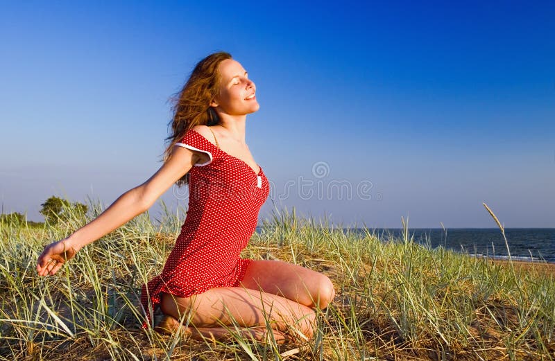 Girl on a dune-2 stock photo. Image of hair, grass, look - 968384