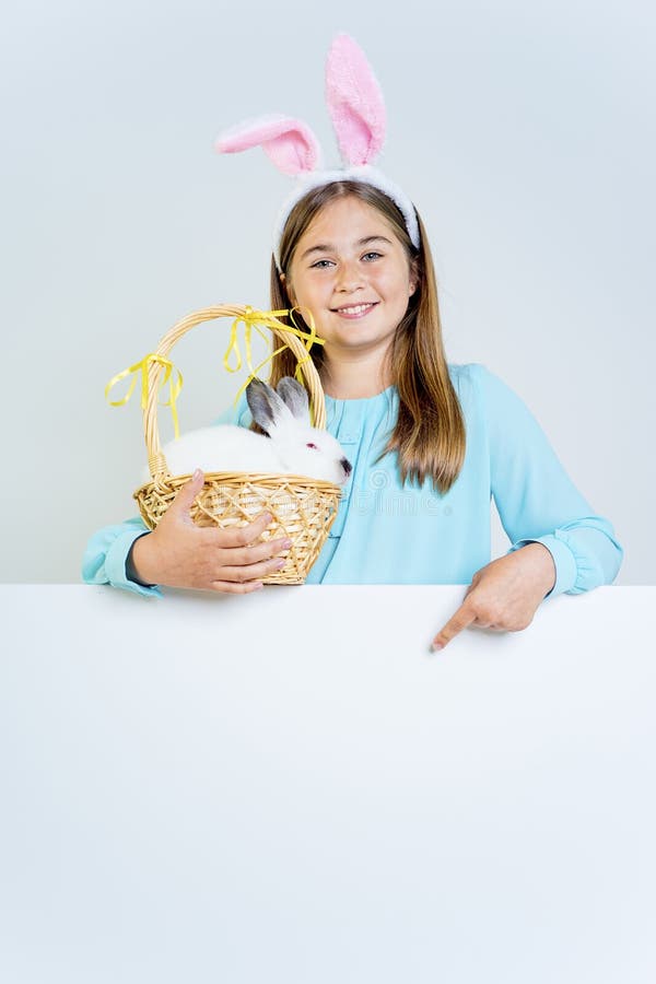 Girl with easter bunny stock photo. Image of colorful - 103066750