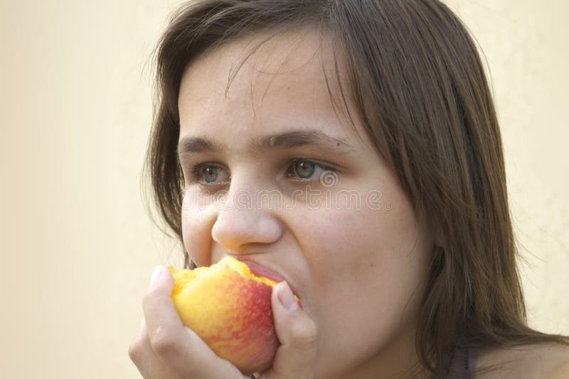 Girl Eating Big Peach Picture. Image: 2701458