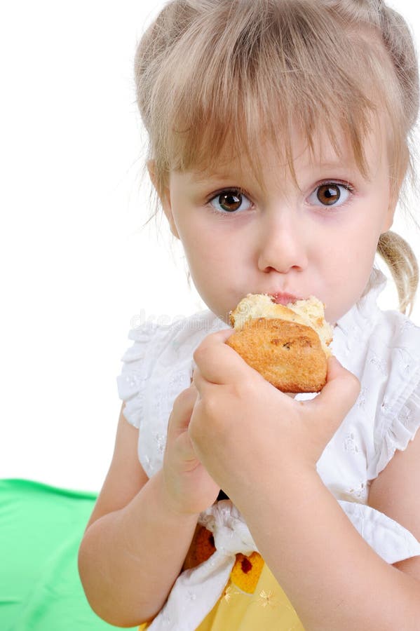 Hungry child eating bread stock image. Image of emotions - 44041255