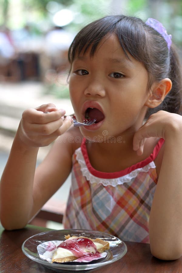 Girl eating cake stock image. Image of smile, person - 26224183