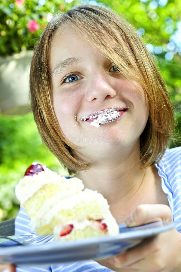 Girl eating a cake stock image. Image of child, icing - 5932621