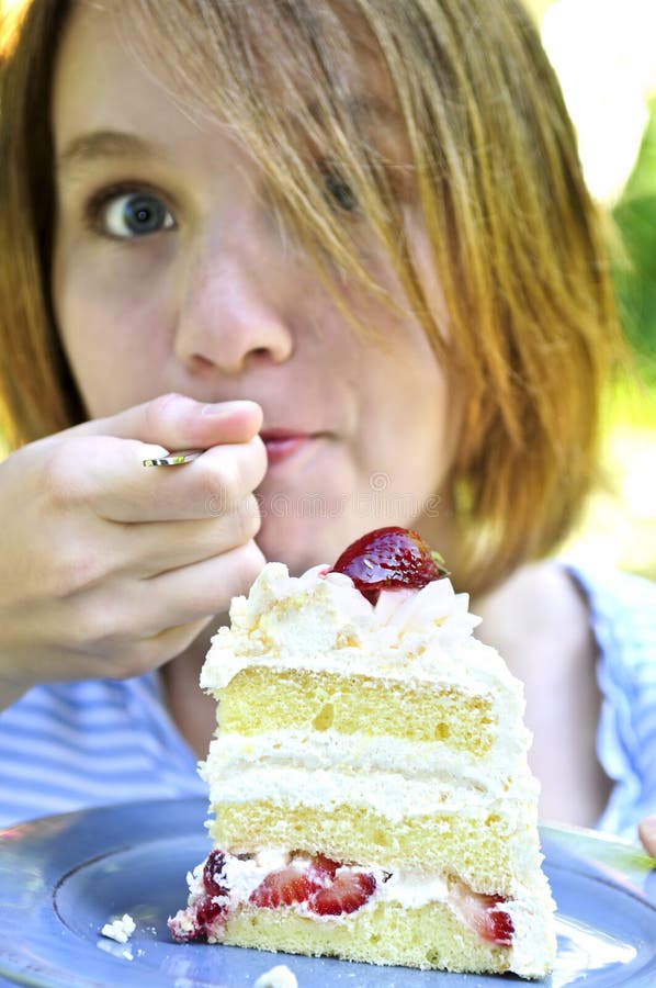Girl eating a cake stock image. Image of child, icing - 5932621