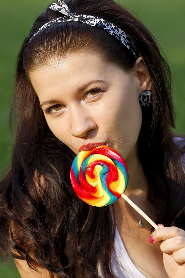 Girl eating candy stock image. Image of close, complexion - 27999349