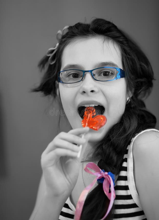 Girl eating candy stock photo. Image of delicious, tasty - 37276820