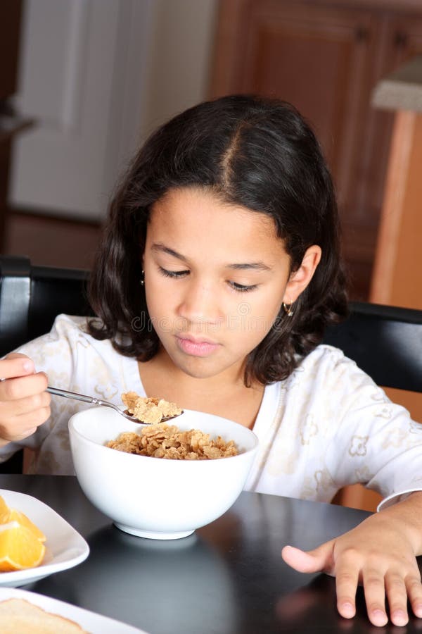 Beautiful Brunette Little Girl Eating Healthy Whole Grain Cereals ...