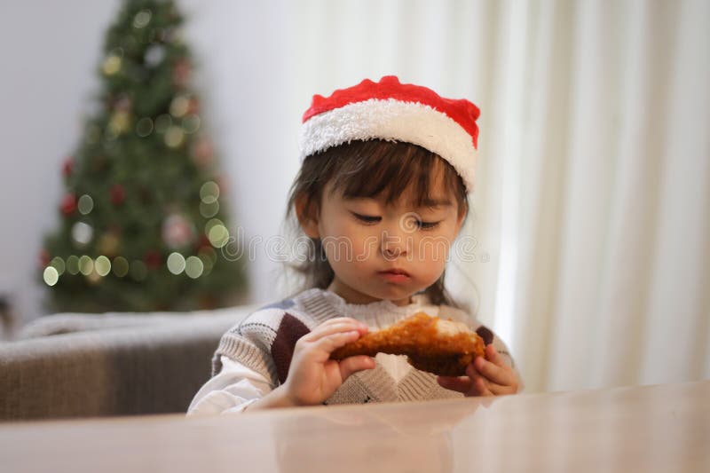 Girl eating chicken stock photo. Image of life, santa - 324839576