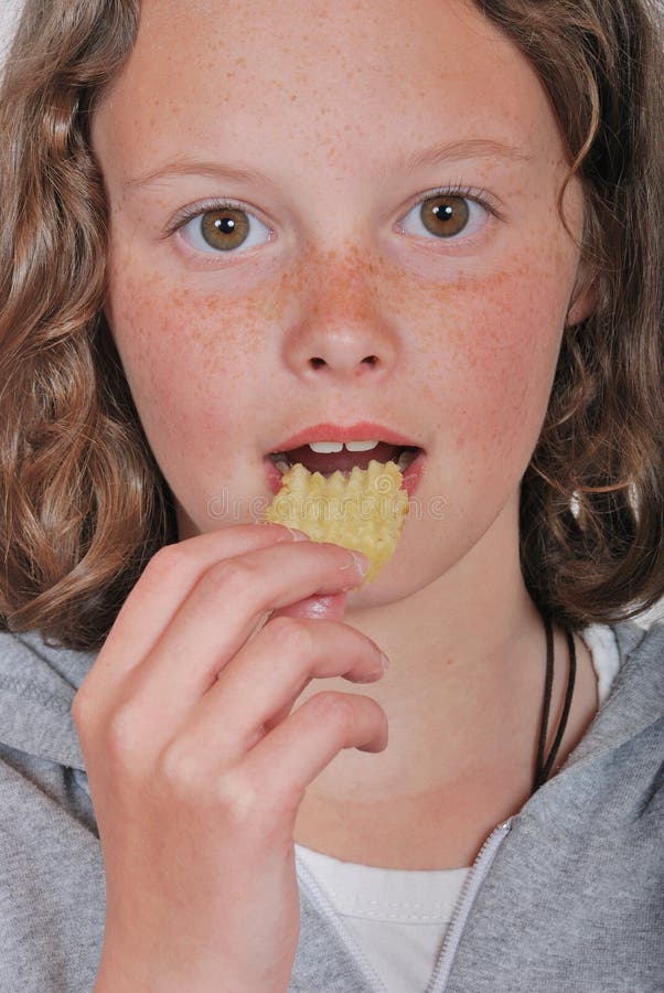 Girl eating chip stock photo. Image of happiness, chip - 34835778