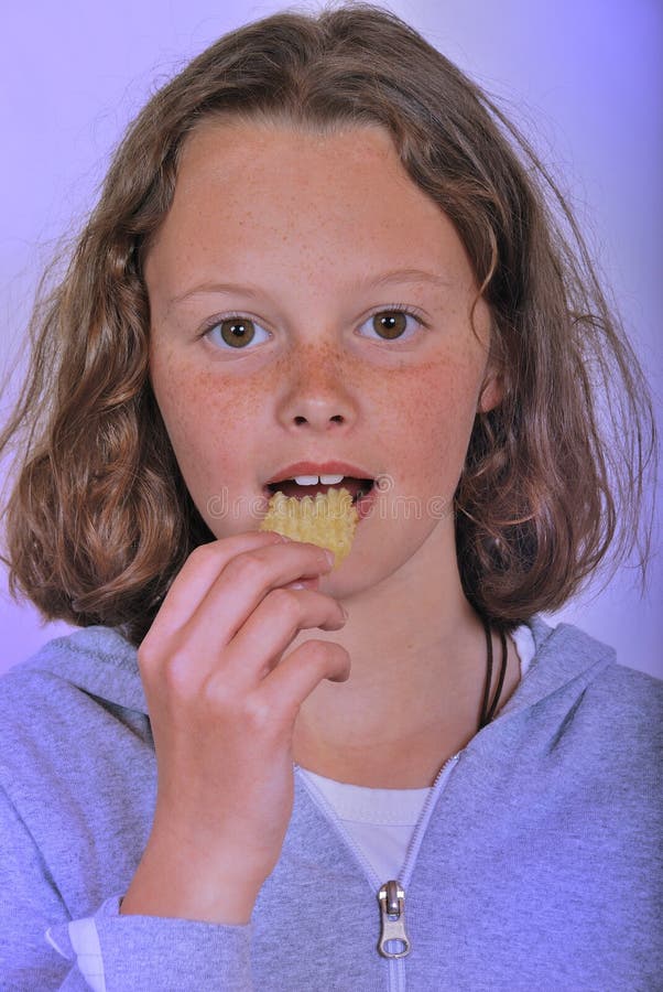 Girl eating chip stock photo. Image of happy, health - 50948824
