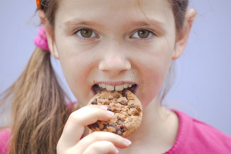 Girl Eating Chocolate Cookies Stock Photo - Image of girl, sugar: 20252004