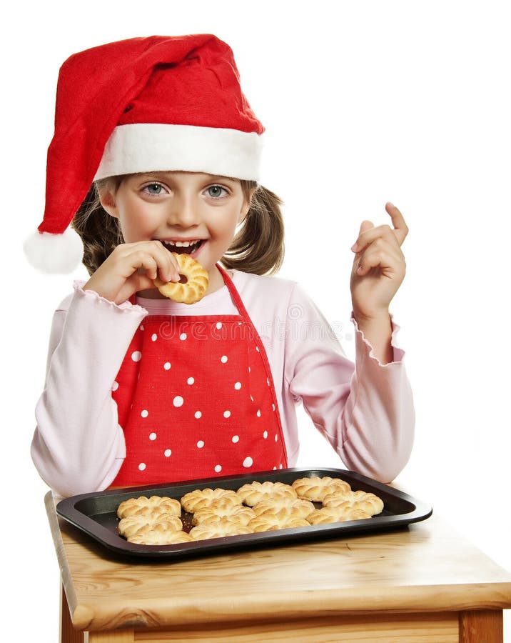 Girl Eating Christmas Cookies Stock Image - Image of cute, apron: 26613395
