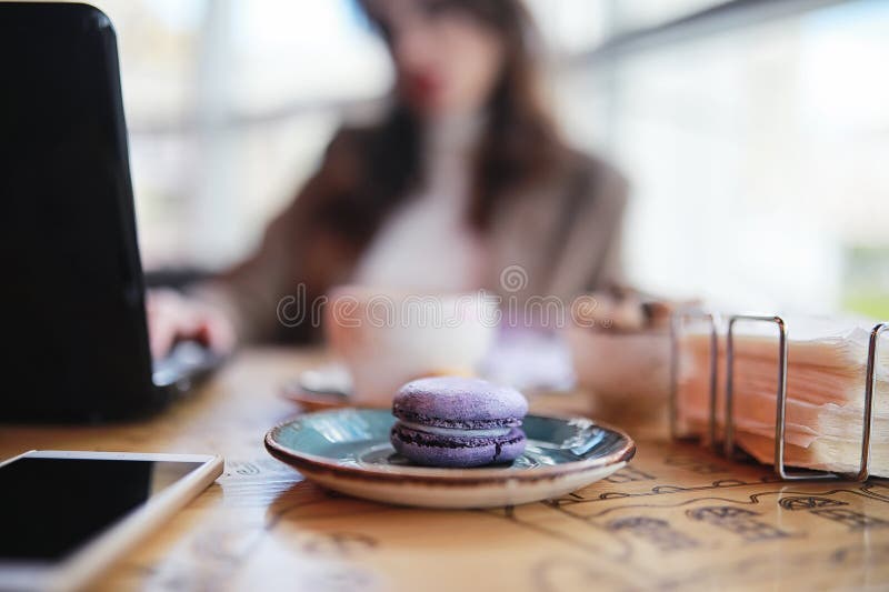 Girl eating coffee cakes stock image. Image of break - 346177347