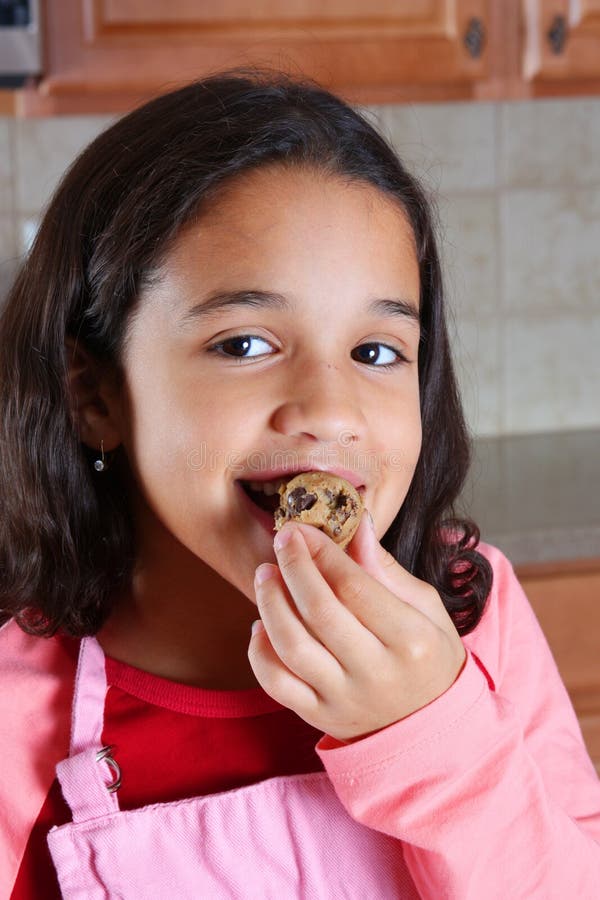 Girl Eating Dough stock photo. Image of inside, pretty - 7175690
