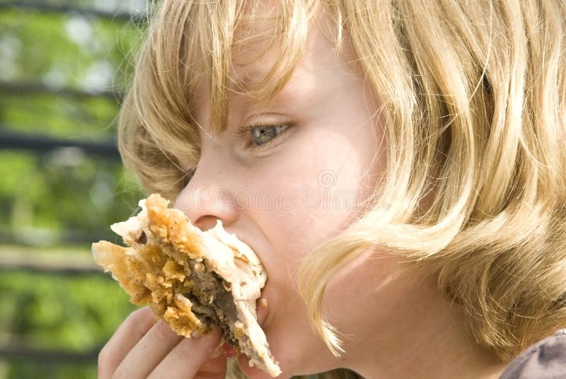 Girl Eating Fried Chicken stock image. Image of close - 5961889