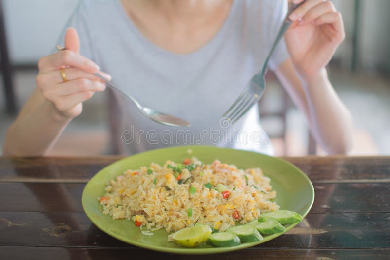 Girl Eating Fried Rice on Soft Focus Stock Photo - Image of fish ...