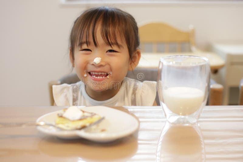 Girl eating hot cake stock photo. Image of bright, space - 324603700