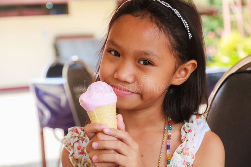 Girl eating Ice Cream stock image. Image of restaurant - 44553701