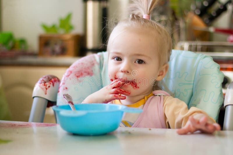 Kid eating strawberry jam stock photo. Image of baby - 31184380