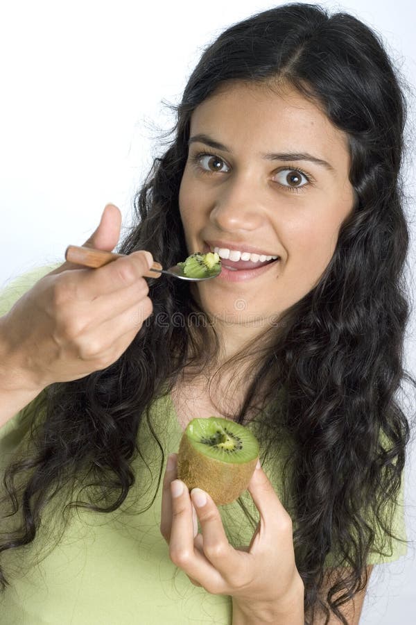 Girl eating kiwi stock photo. Image of nutrition, fruit - 2660914
