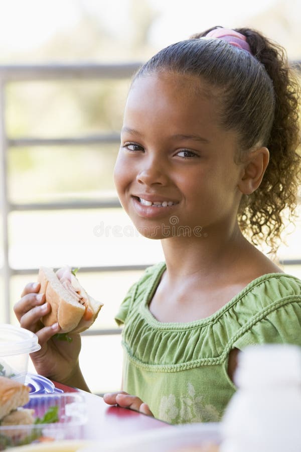 Girl Eating Lunch at Kindergarten Stock Image - Image of color, girl ...