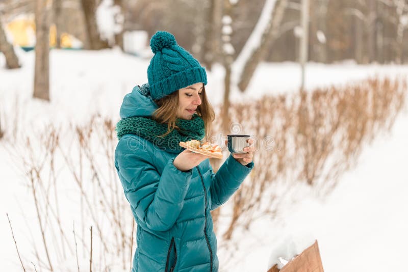 Girl Eating Pizza in the Cold Winter Stock Image - Image of warm ...