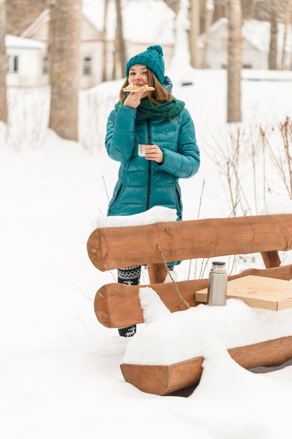 Girl Eating Pizza in the Cold Winter Stock Image - Image of model ...