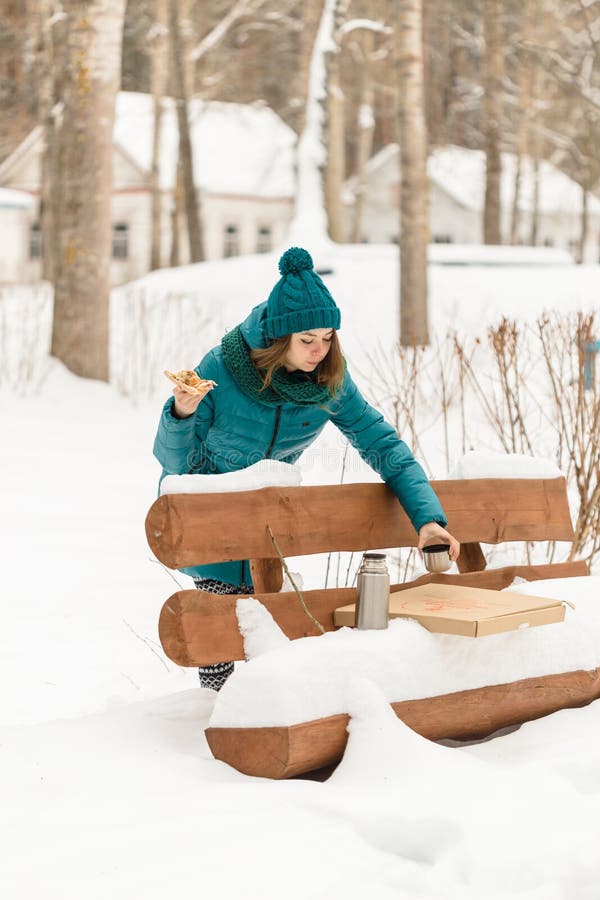 Girl Eating Pizza in the Cold Winter Stock Photo - Image of street ...