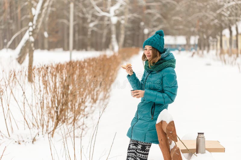 Girl Eating Pizza in the Cold Winter Stock Photo - Image of face ...