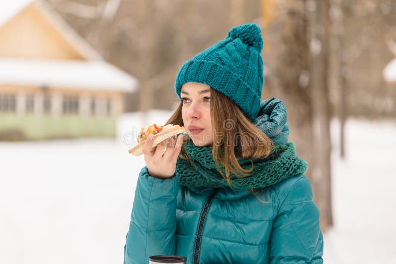 Girl Eating Pizza in the Cold Winter Stock Image - Image of cold ...