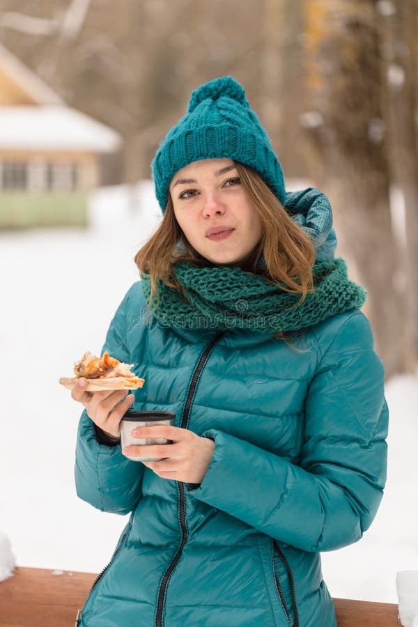 Girl Eating Pizza in the Cold Winter Stock Photo - Image of season ...