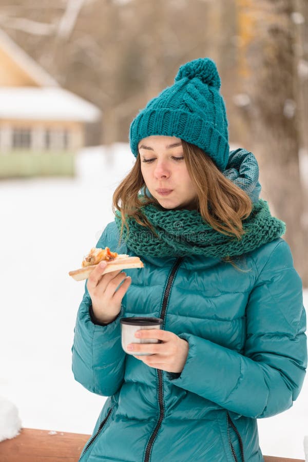Girl Eating Pizza in the Cold Winter Stock Image - Image of cold ...