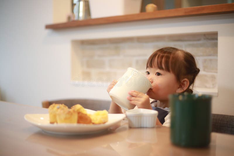 Girl eating a snack stock image. Image of food, child - 238288365