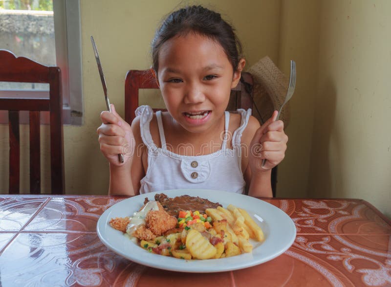 Girl eating Steak stock photo. Image of plate, cooked - 40792308