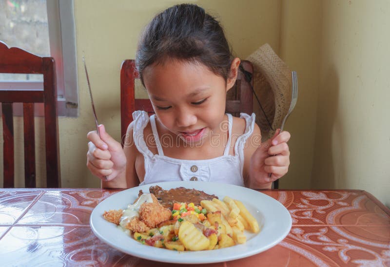 Girl eating Steak stock image. Image of happiness, potatoes - 40792313