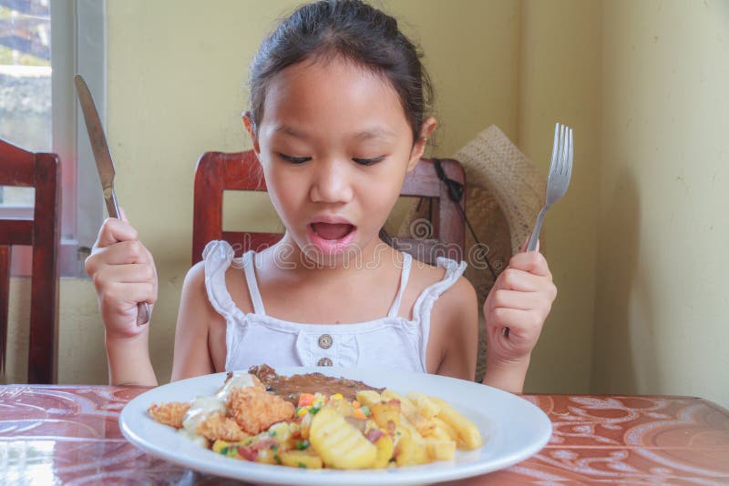 Girl eating Steak stock photo. Image of plate, grilled - 40792330