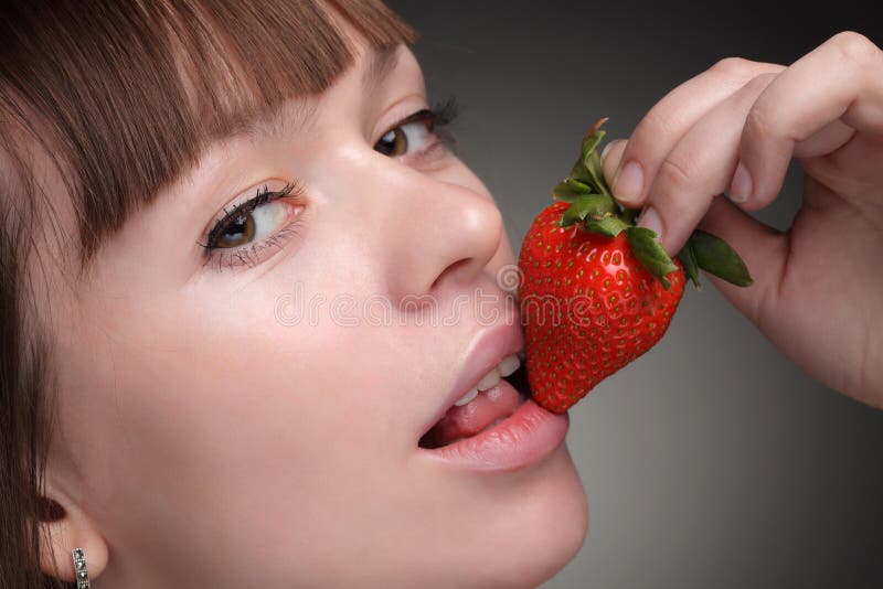 Beauty Girl Eating Strawberries Stock Photo - Image of lifestyles ...