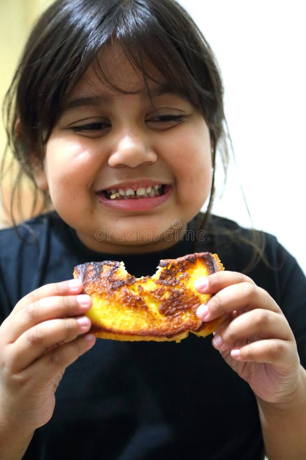 Girl Eating Toast stock image. Image of testy, joyful - 52443847