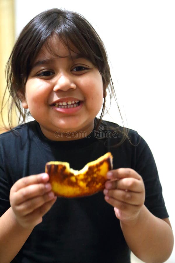 Girl Eating Toast stock image. Image of live, kids, young - 52443863