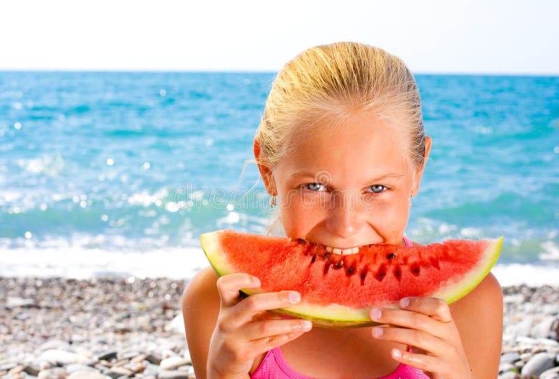 Girl Eating Watermelon on Seashore or Beach Stock Photo - Image of ...