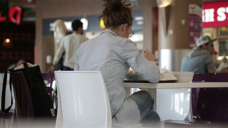 The Girl Eats a Lunch Break at a Cafe at a Table Stock Footage - Video ...