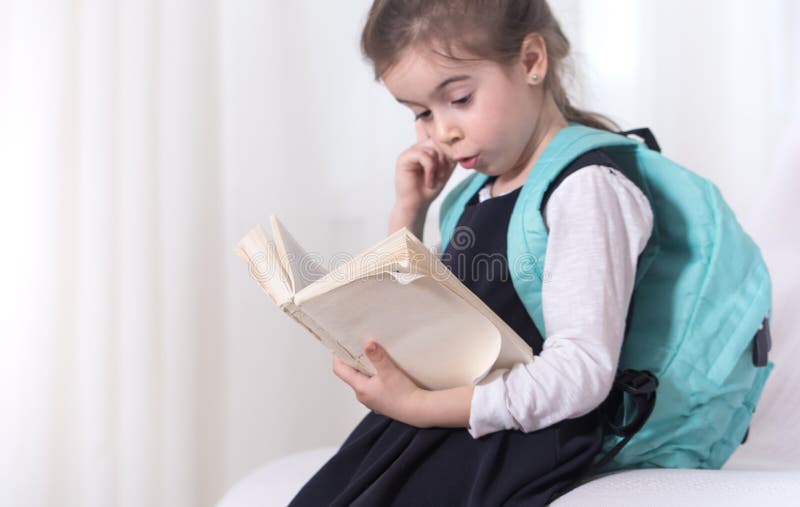 Girl-elementary School Student with a Backpack and a Book Stock Image ...