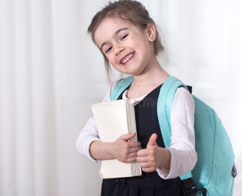 Girl-elementary School Student with a Backpack and a Book Stock Image ...