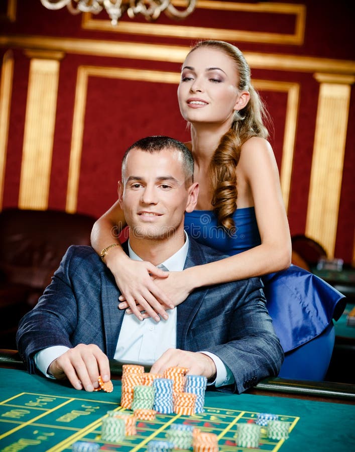 Girl Embracing Gambler at the Playing Table Stock Image - Image of ...