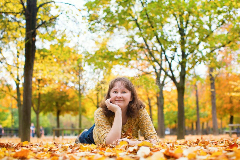 Girl Enjoying Bright Fall Day in Park Stock Photo - Image of caucasian ...