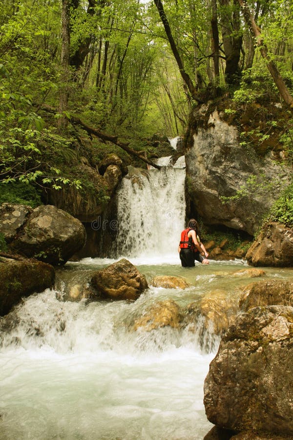 The Girl is Enjoying the Waterfall Stock Photo - Image of curly ...