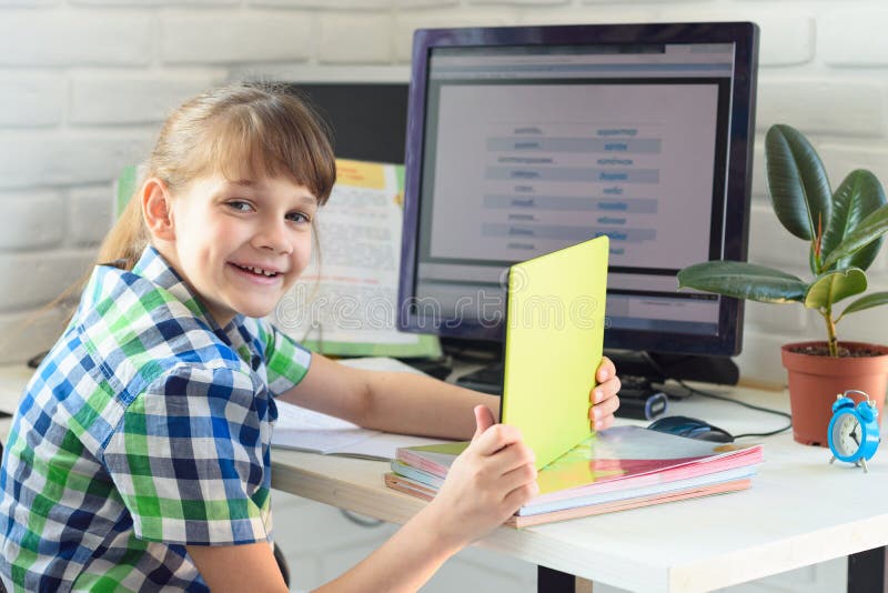 Girl Enjoys Doing Homework at the Computer Stock Photo - Image of ...