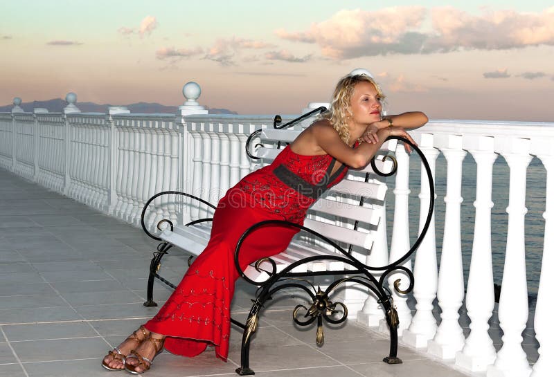Girl in Evening Red Dress Sitting on a Bench Stock Photo - Image of ...