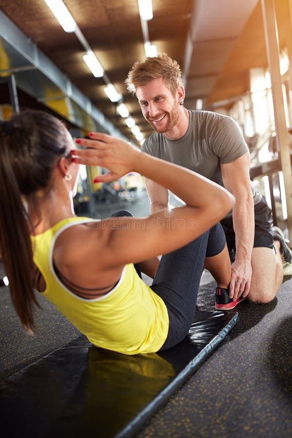 Girl Exercises with Trainer Stock Photo - Image of lifestyle, equipment ...