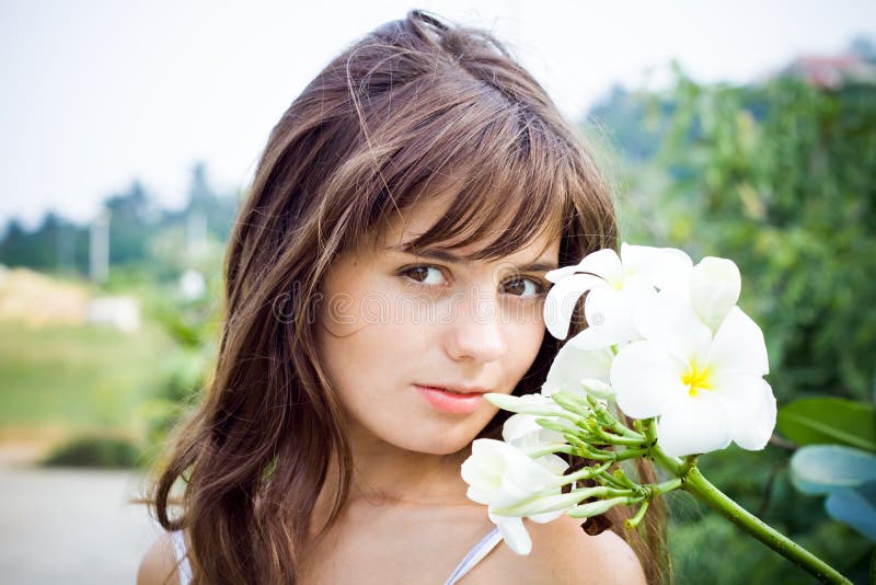Girl with exotic flowers. stock photo. Image of human - 13268062