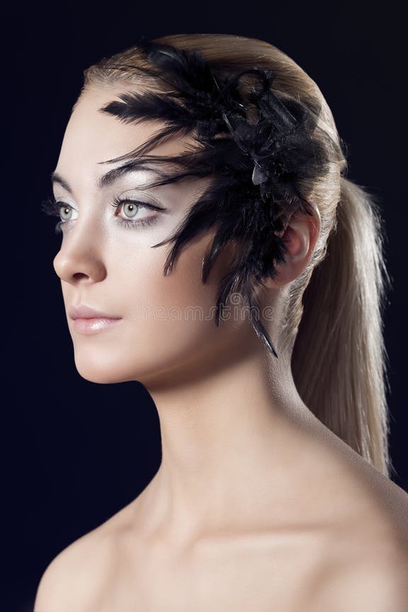 Girl with Feathered Accessory Looks at Right Stock Photo - Image of ...
